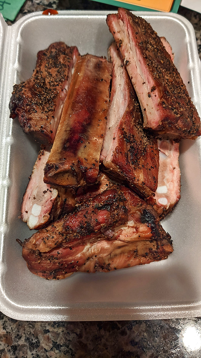 Behold, the holy grail of BBQ! These ribs look so tender, they might just fall off the bone if you stare at them too long.