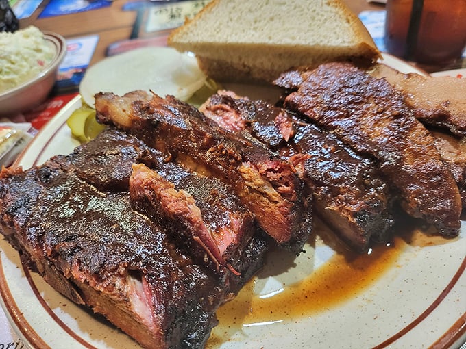 These ribs aren't just falling off the bone&mdash;they're practically volunteering to jump onto your fork, their smoke-kissed exterior hiding tender meat beneath.