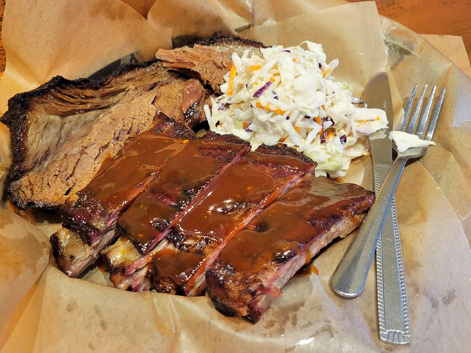 Holy smoke rings, Batman! These ribs and brisket look so tender, they might just fall off the plate if you stare too long.