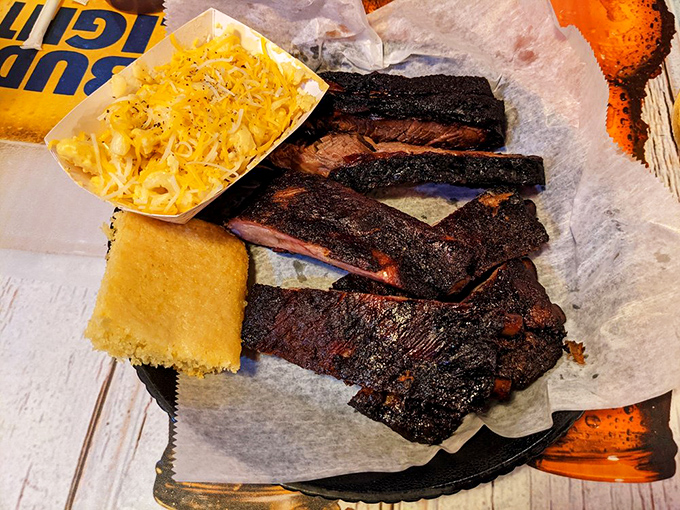 Holy smoke rings, Batman! These ribs and brisket look so good, they might just make vegetarians question their life choices.