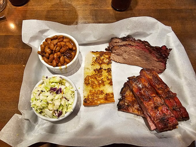 BBQ perfection on butcher paper. That smoke ring on the brisket is like nature's way of applauding the pitmaster's patience.