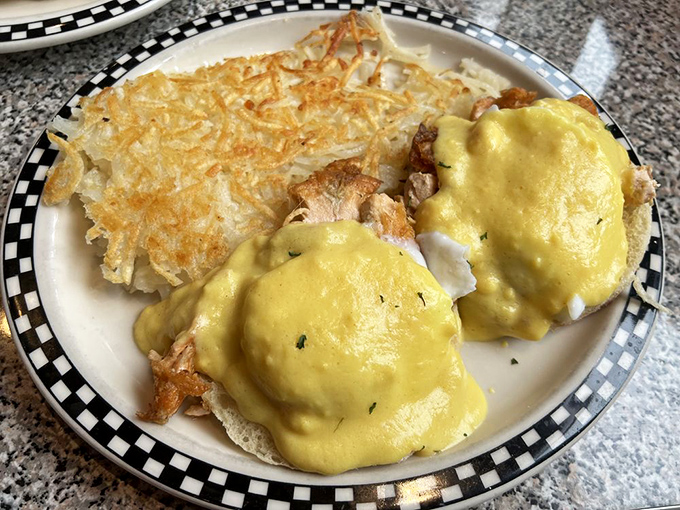 Eggs Benedict's fancy cousin came to play. Golden hollandaise cascades over perfectly poached eggs, while crispy hash browns stand guard.