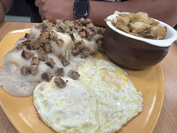 Holy gravy, Batman! This plate of sausage, biscuits, and gravy looks like it could cure everything from a broken heart to a stubborn hangnail.