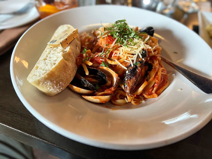 Pasta that's gone rogue and joined a seafood circus. This dish is a flavor acrobat, balancing delicate noodles with bold ocean treasures.