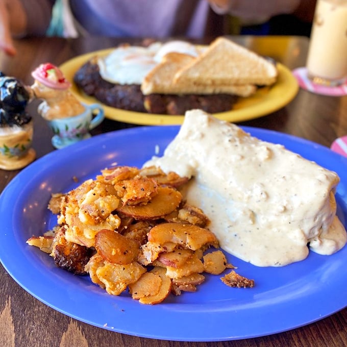 Breakfast burrito or edible hug? This smothered masterpiece is comfort food incarnate, wrapped in a tortilla and drenched in a sauce that dreams are made of.