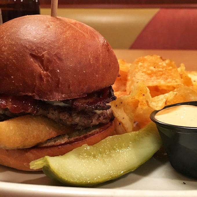 Holy moly, that's a burger! Stacked higher than my college textbooks, this bad boy is a testament to the art of indulgence.