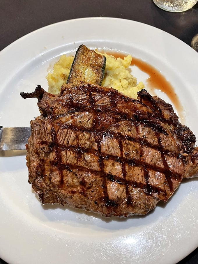 This isn't just a steak; it's a work of art. Perfectly grilled USDA Prime Rib Eye, so juicy it practically winks at you from the plate.