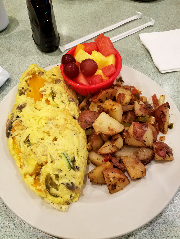 Behold, the veggie omelet that could convert carnivores! It's so packed with goodness, you'll swear you can hear the vegetables high-fiving each other.