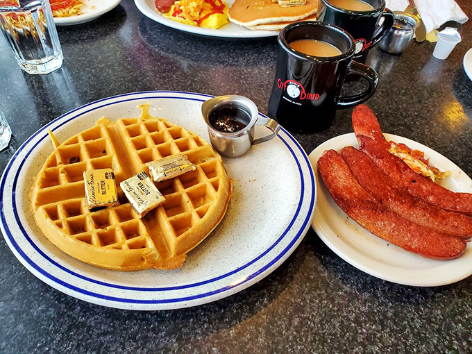 Golden waffles and sausages that could make a vegetarian weep – this plate is the breakfast equivalent of a warm hug from your favorite aunt.
