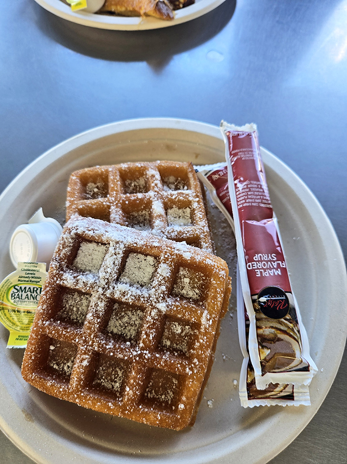 Waffle perfection achieved! Golden, crispy, and dusted with powdered sugar &ndash; it's breakfast's way of saying "Aloha!"