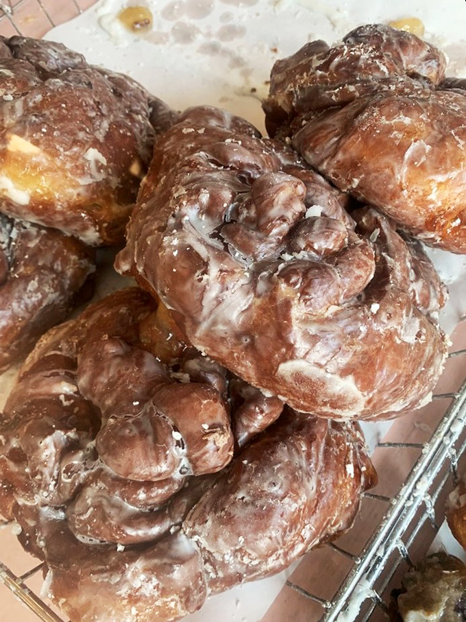 These apple fritters aren't just donuts&mdash;they're architectural marvels of caramelized crust and tender apple pockets. Worth every delicious calorie and momentary guilt.