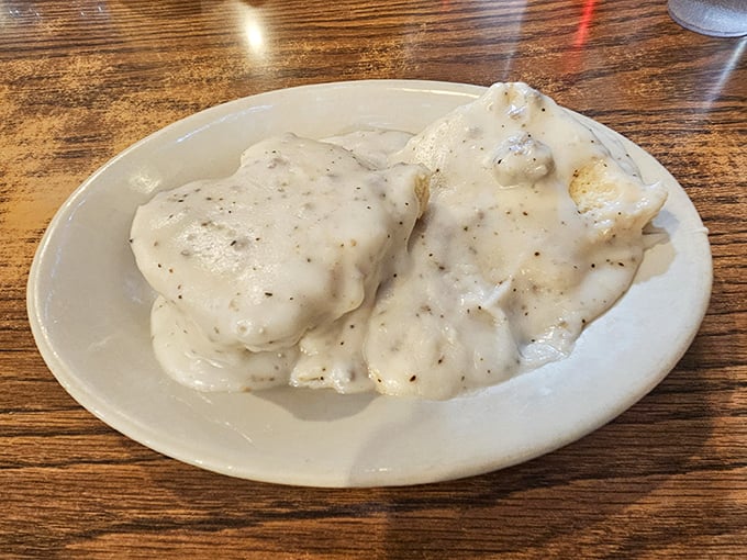 Biscuits and gravy: the breakfast of champions and the kryptonite of diets. These fluffy clouds smothered in peppery goodness are worth every delicious calorie.