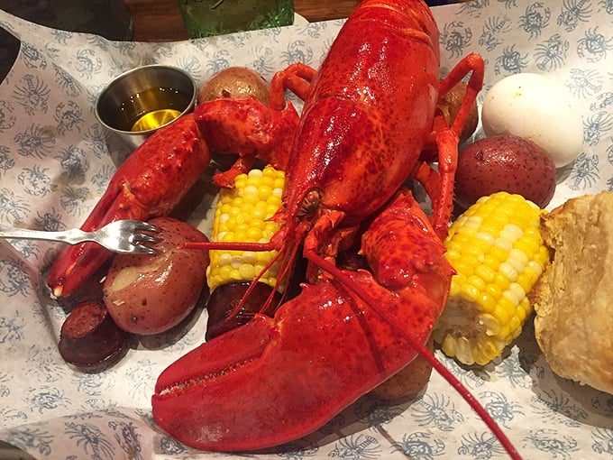 The star of the show, in all its red-shelled glory! This lobster feast is what seafood dreams are made of.