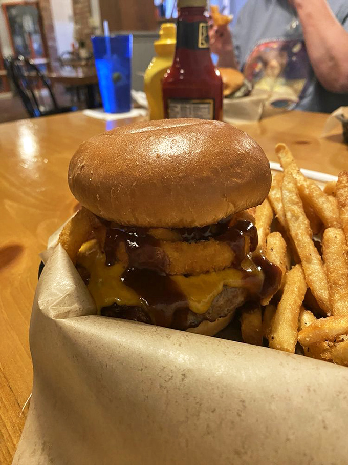Holy smokes, that's a burger! Juicy, cheesy, and stacked higher than a Midwest corn silo &ndash; it's the American dream between two buns.