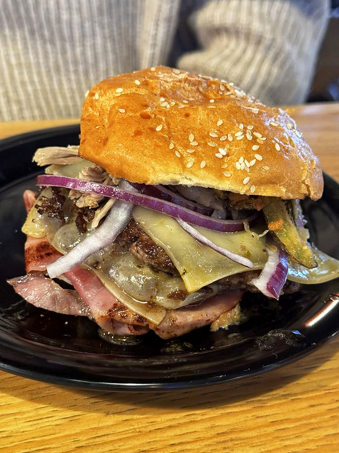 This isn't just a burger; it's a tower of terror for your taste buds! Stacked high with toppings, it's a meal that bites back.