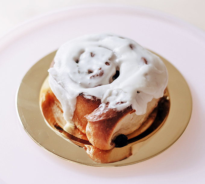 Holy cinnamon swirl, Batman! This roll isn't just breakfast; it's a warm hug for your soul, frosted with pure happiness.