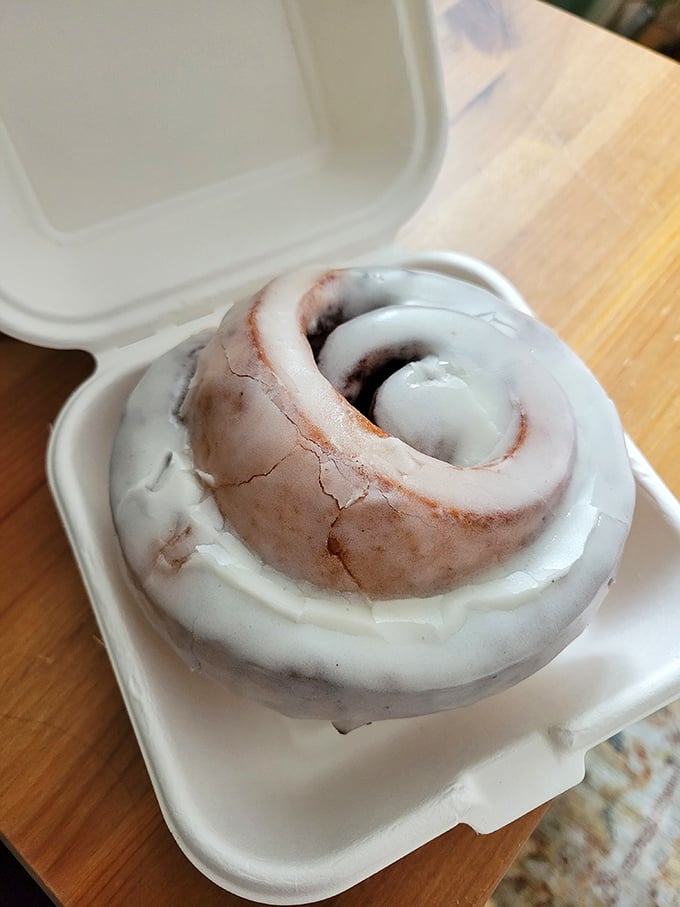 Behold, the cinnamon roll that launched a thousand diets... and broke them all. This gooey masterpiece is worth every sticky finger.