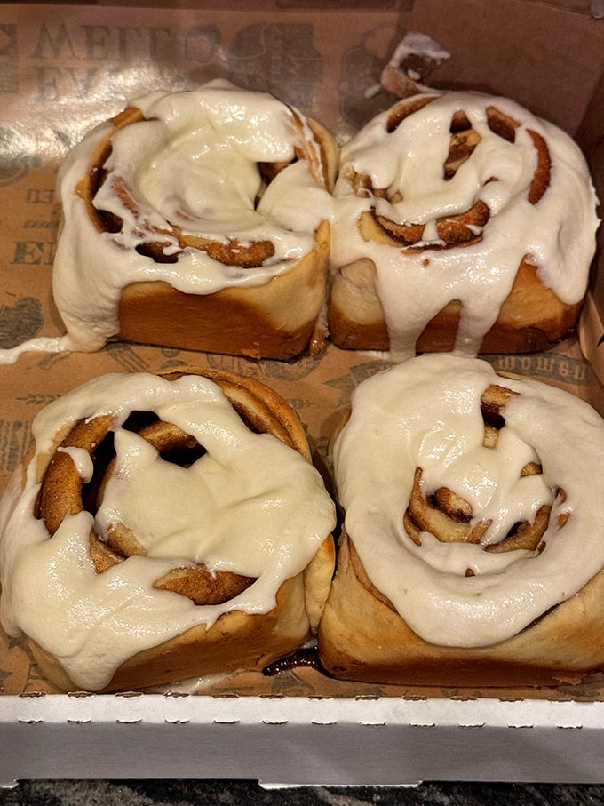 Behold, the holy grail of breakfast pastries! These cinnamon rolls are so generously frosted, they could double as life rafts in a sea of coffee.