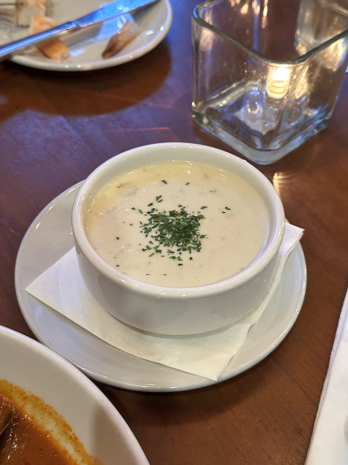 Ladies and gentlemen, I present to you the holy grail of comfort food: Boone's clam chowder. It's like a warm, creamy hug for your taste buds.