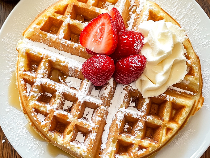 Waffle perfection that would make Leslie Knope weep with joy. Crispy, fluffy, and topped with nature's candy &ndash; it's breakfast nirvana on a plate.