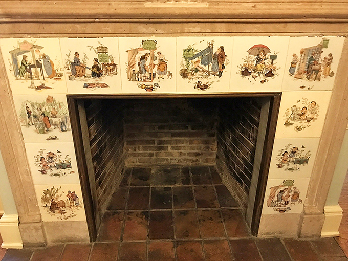 Cozy up to history with this fireplace. Its whimsical tiles tell stories that'll warm you faster than the flames ever could.