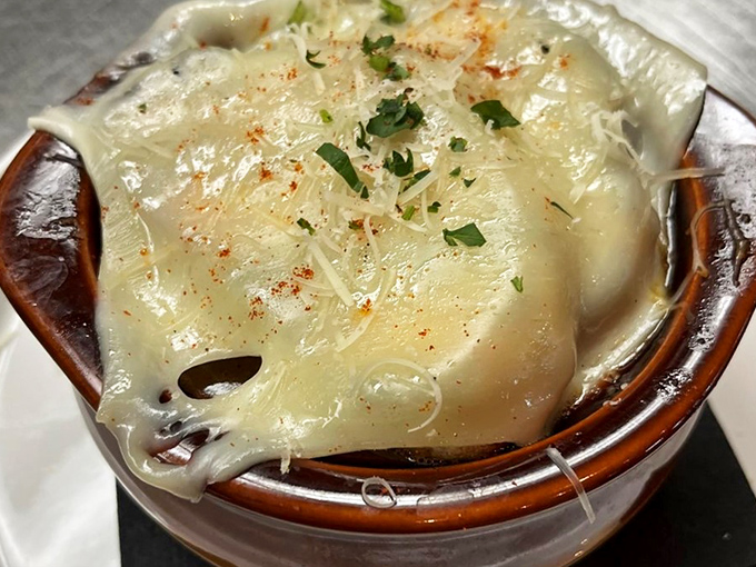 Behold, the crown jewel of comfort food! This French onion soup is so cheesy, it could star in its own rom-com.