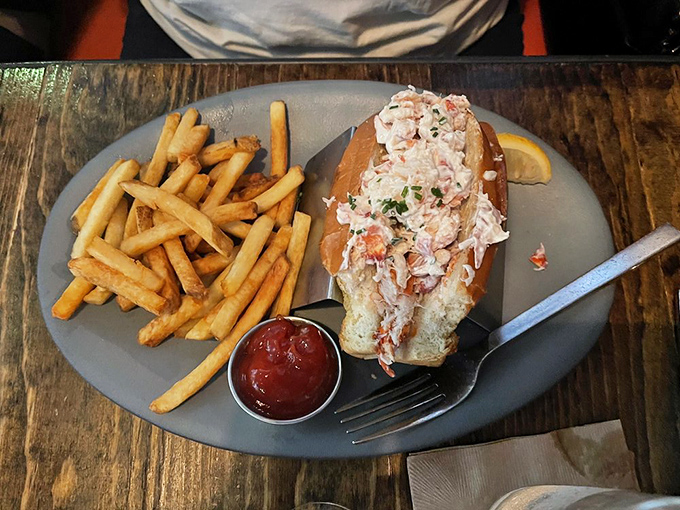 Lobster roll, oh my! This beauty could make a New Englander weep with joy. Paired with those golden fries, it's a match made in seafood heaven.