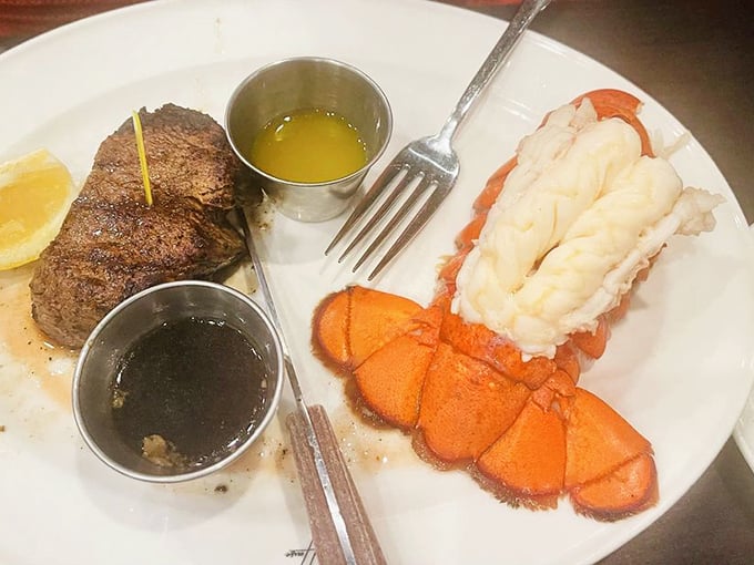 Holy crustacean, Batman! This lobster tail is so plump and juicy, it looks like it's ready to swim right off the plate.