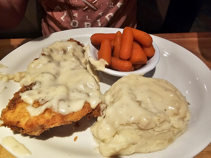 Behold: the star of our show! That cloud of mashed potatoes alongside country fried steak with gravy is what dreams are made of. Carrots for color (and health, supposedly).