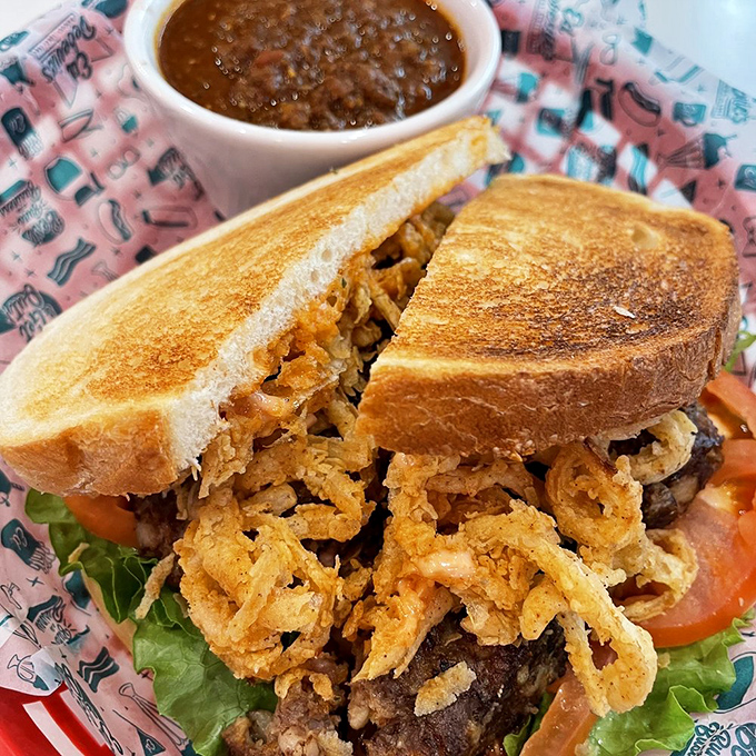 Holy cow, that's a sandwich! Ed's meatloaf masterpiece is stacked higher than my hopes for fitting into my high school jeans again.