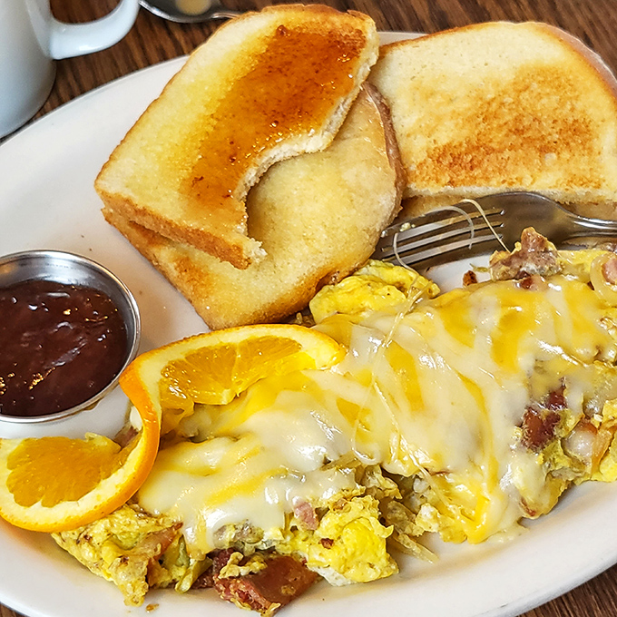 Cheese lovers, rejoice! This omelet is so packed with gooey goodness, it could double as a life vest in a sea of hunger.