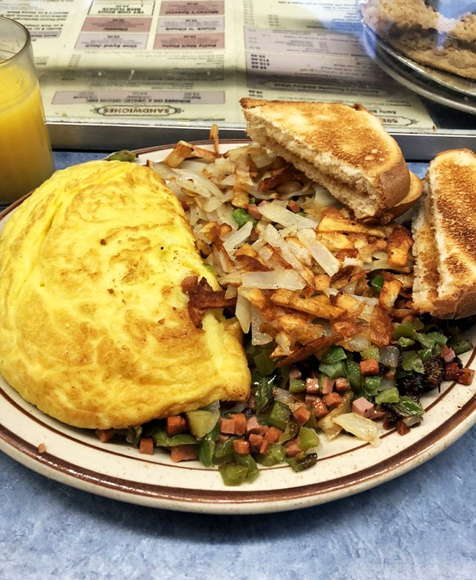 Behold, the omelet of champions! This golden masterpiece could make even Rocky Balboa weak in the knees.