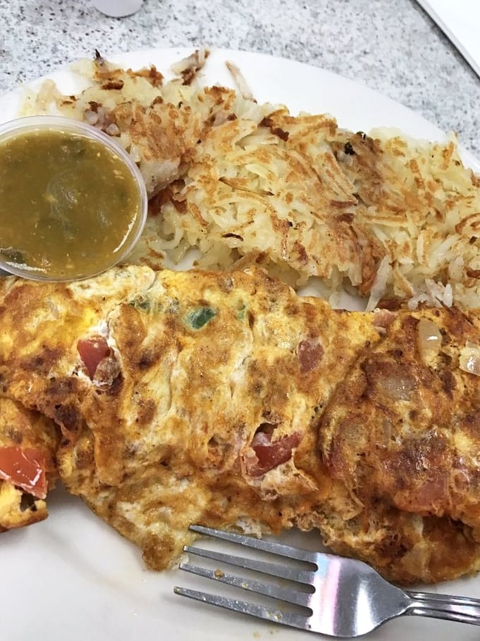 Behold the Denver omelet in its natural habitat&mdash;a perfect golden exterior giving way to a treasure trove of peppers, ham, and cheese.