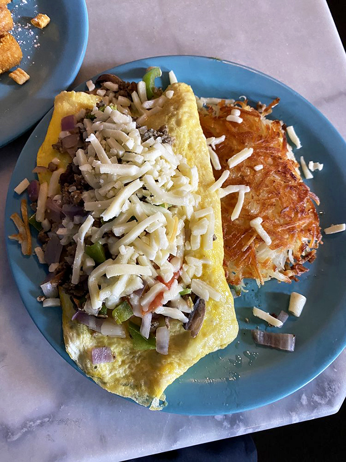 Behold, the omelet of champions! Packed with more goodies than your grandma's purse, it's a breakfast gold medal.