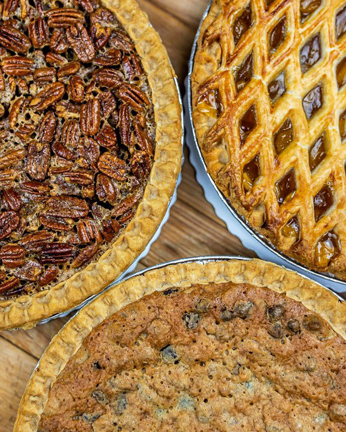 Pie trifecta alert! Pecan, lattice-topped fruit, and... is that chocolate chip? It's like the holy trinity of desserts, but even more divine.