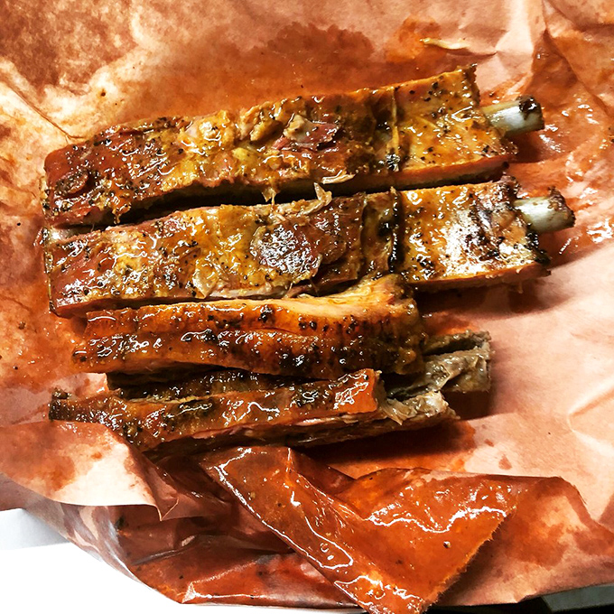 Holy smokes, those ribs! Glistening with a perfect bark and promising fall-off-the-bone tenderness, these beauties are what barbecue dreams are made of.