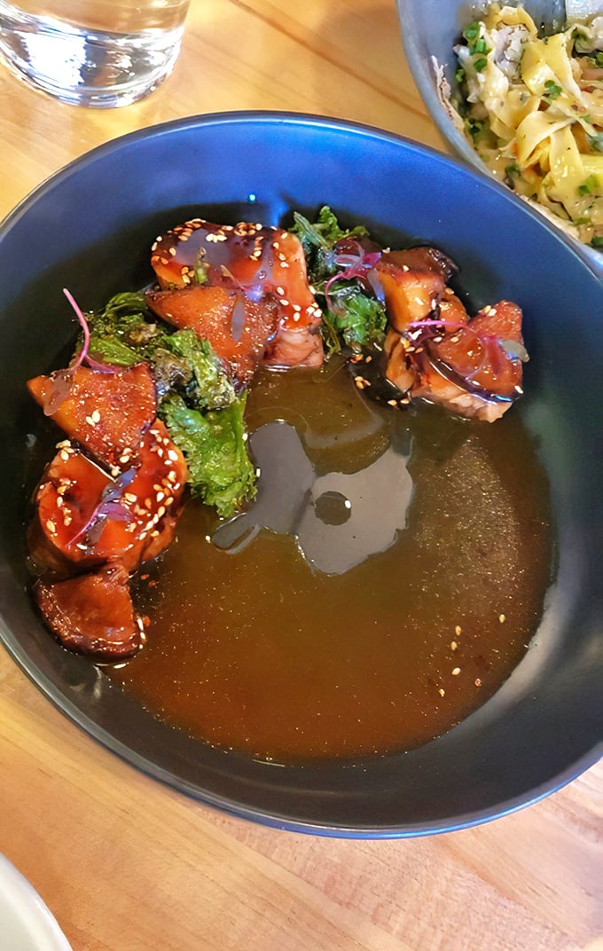 These glazed morsels swim in a broth so rich it should file separate tax returns. The sesame seeds add just the right textural pop.