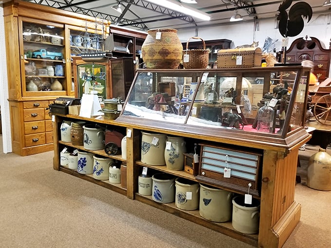 Pottery paradise! From rustic crocks to delicate china, this display has more layers than a archaeological dig site.