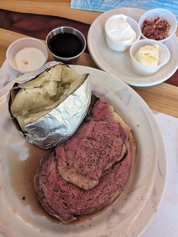 Behold the king of comfort food: a prime rib that could make a vegetarian weep. Paired with a baked potato that's practically its own side dish.