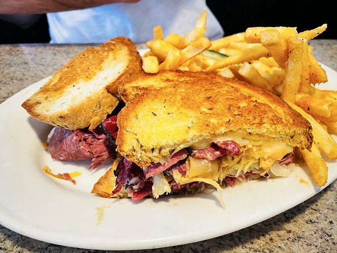 Holy moly, would you look at that Reuben! It's stacked higher than a poker player's chip pile on a lucky night.