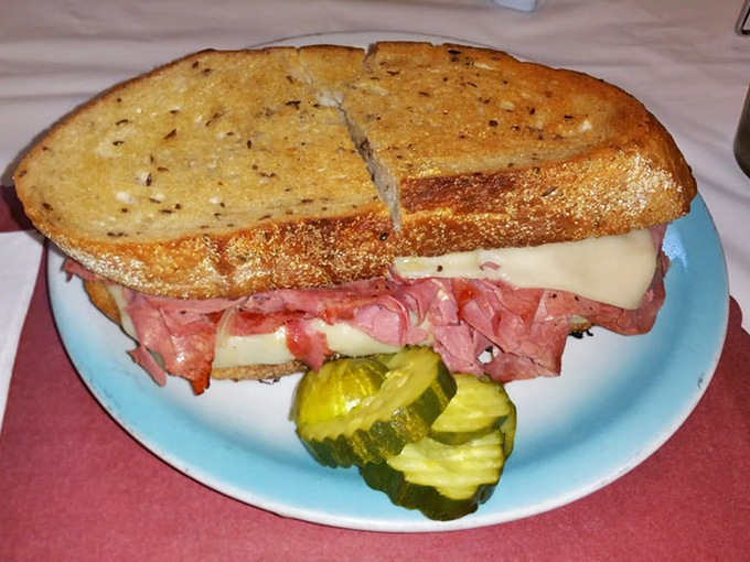 This isn't just a sandwich; it's a monument to corned beef perfection where every layer plays its part in the symphony.