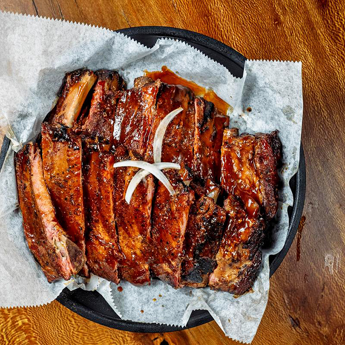 These ribs aren't just fall-off-the-bone tender; they're practically doing the cha-cha off the plate. Finger-licking mandatory!