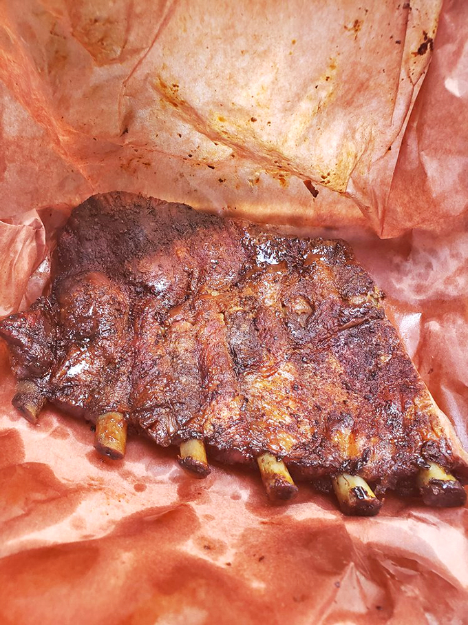 Behold, the holy grail of barbecue! These ribs look so tender, they might just fall off the bone if you stare too hard.