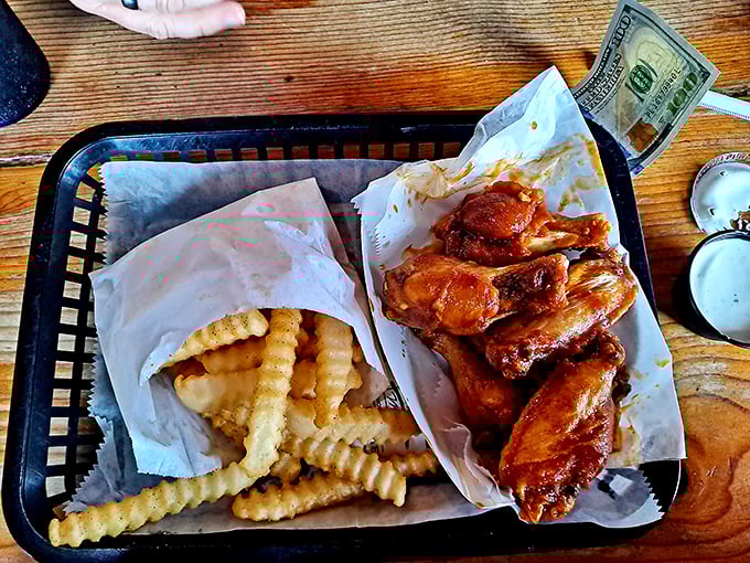 Buffalo wings and crinkle-cut fries: a partnership more perfect than Bogart and Bacall. The sauce glistens with promises it fully intends to keep.