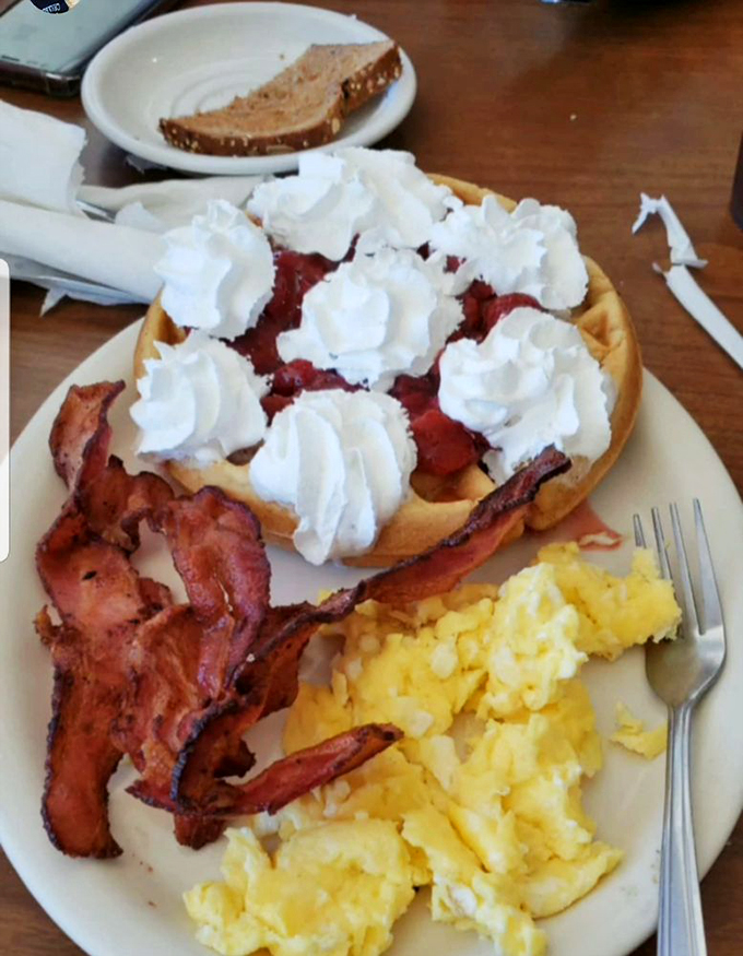 Breakfast of champions, or maybe just very hungry travelers. This waffle's got more toppings than a loaded baked potato at a county fair!