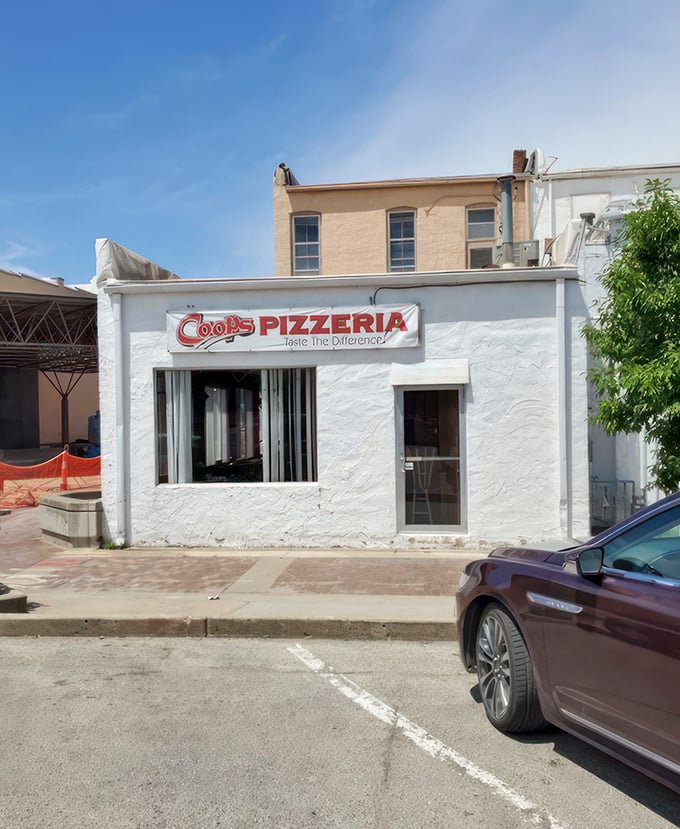 Coop's tiny white building is the pizza equivalent of a poker player with a royal flush not showing their hand.