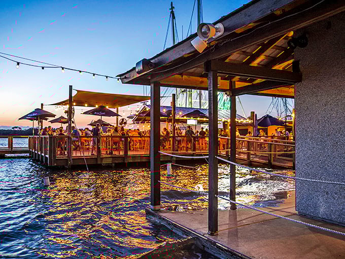 Sunset dreams and seafood schemes! This waterfront deck is where fish tales become delicious realities.