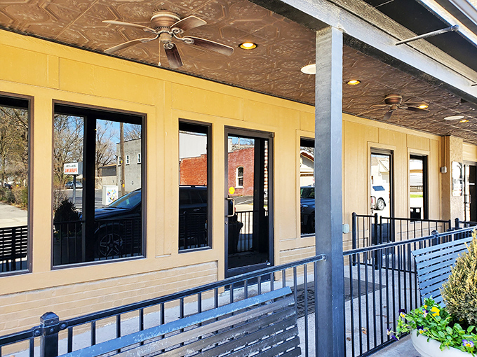 Jess & Jim's: Where tin ceilings meet beefy dreams! This porch invites you to sit a spell and prepare for a steak-tacular experience.