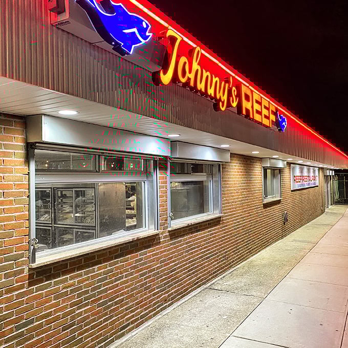 Neon nights and fishy delights! Johnny's Famous Reef Restaurant lights up City Island like a seafood-loving firefly.