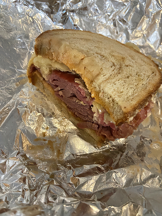 Meat skyscraper alert! This Reuben is stacked higher than your grandpa's stories about walking to school uphill both ways.